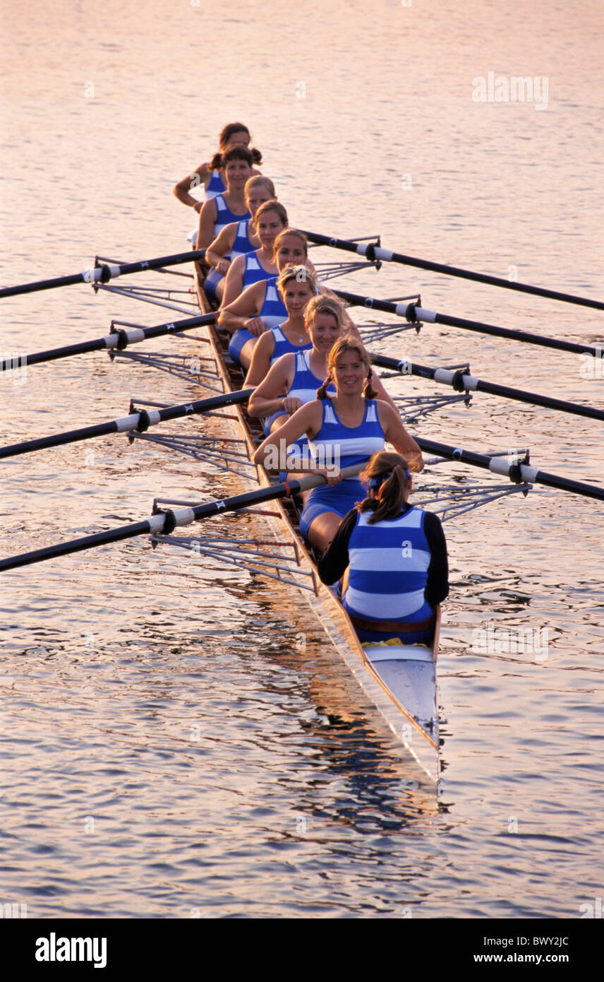eight group lake rowing boat sports team rowing oar women woman people ...