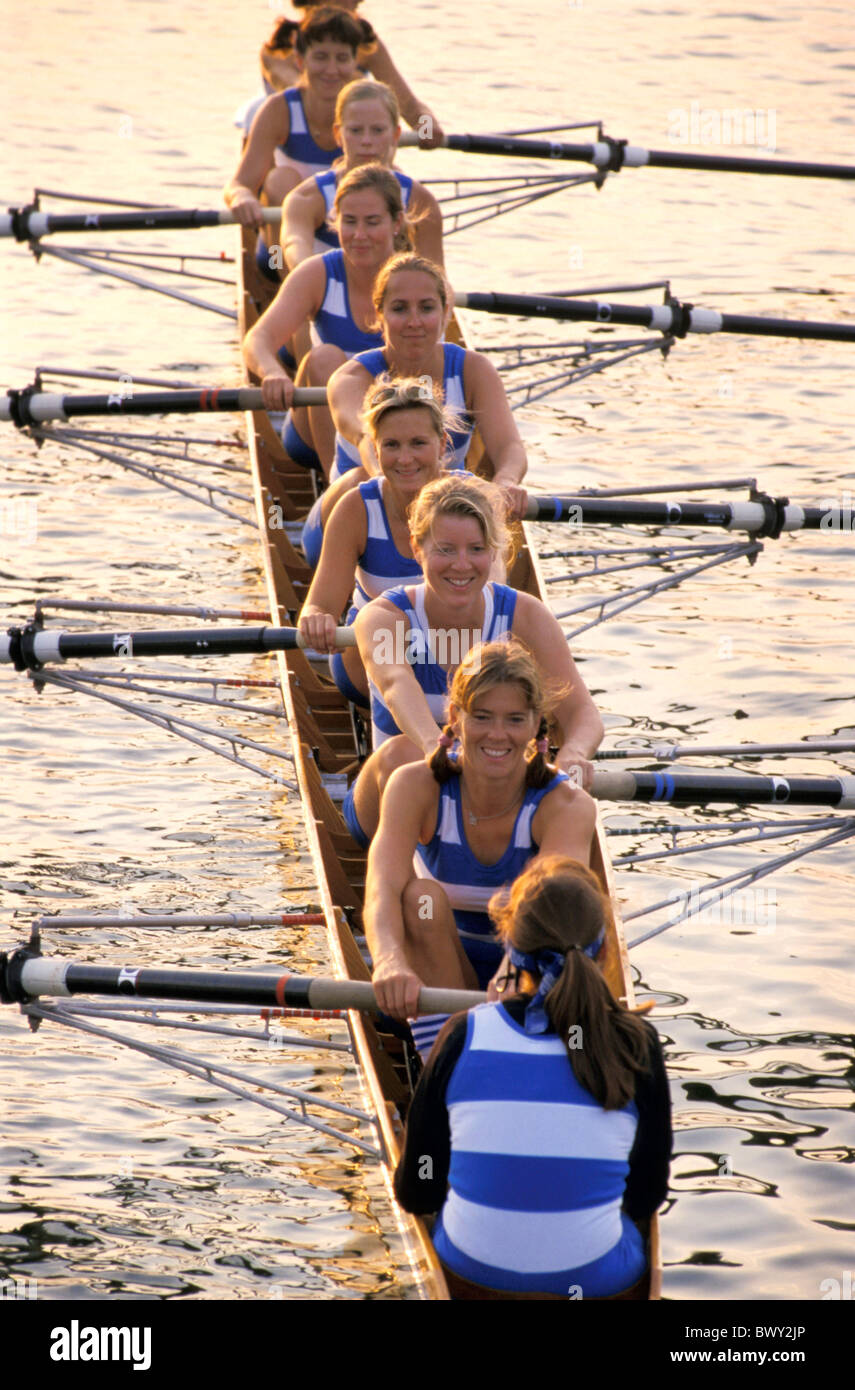 eight group lake rowing boat sports team rowing oar women woman people ...