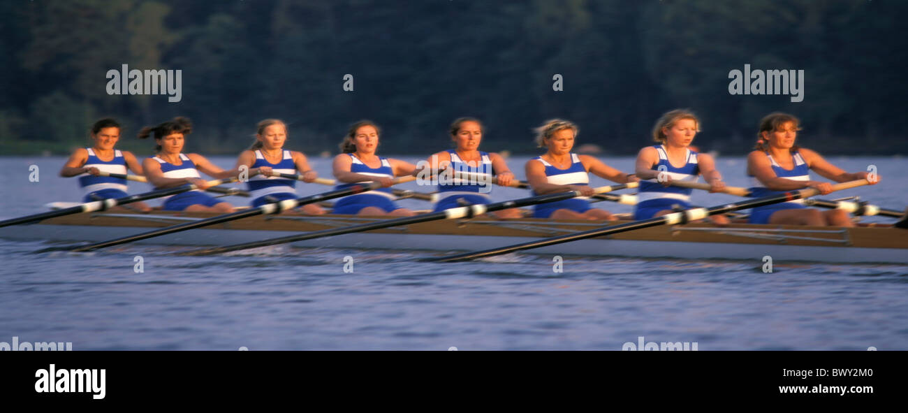 eight group lake rowing boat sports team rowing oar women woman people ...