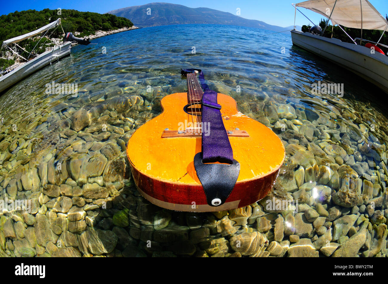 Guitar Floating in Sea, Horgota Beach, Kefalonia Greece Stock Photo - Alamy
