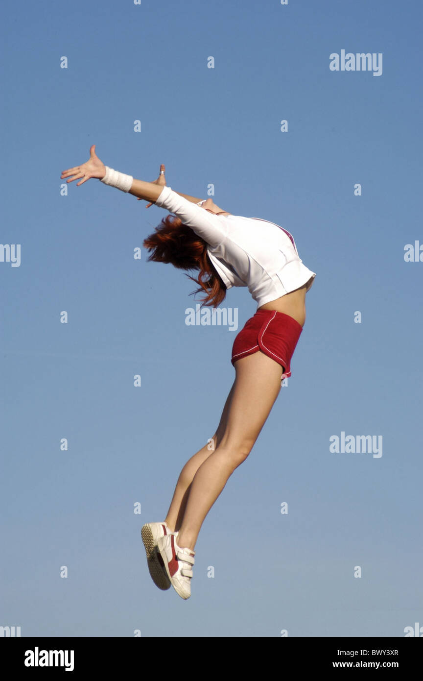 arms stretching Dynamic fitness high jumping jump outside sky sports ...