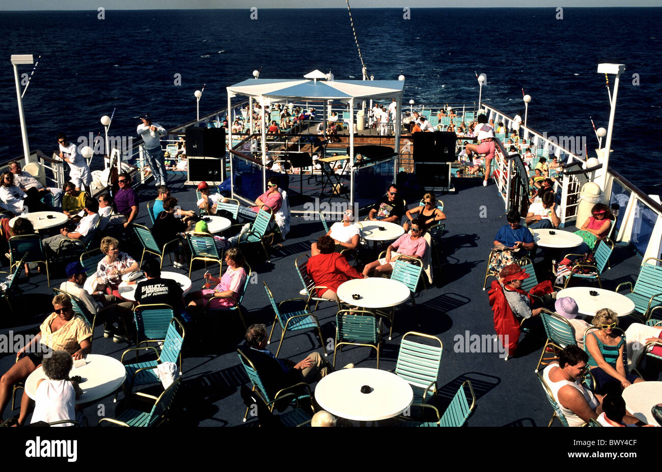 ship cruise ship passengers cruise solar deck tables desks people sea ...