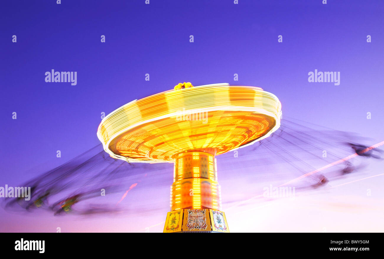 carousel chain carousel dusk fair illuminated mood rotary sky twilight ...