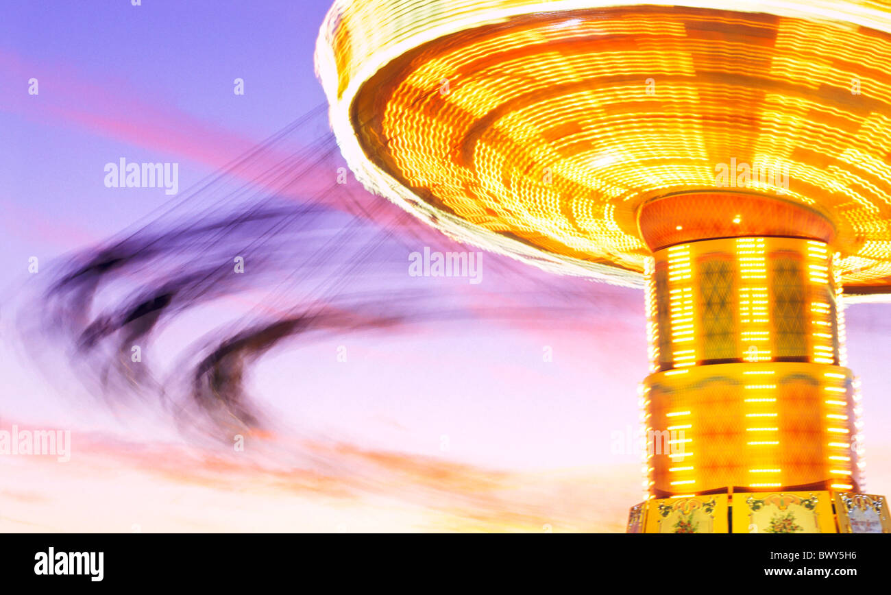 carousel chain carousel dusk fair illuminated mood rotary sky twilight ...