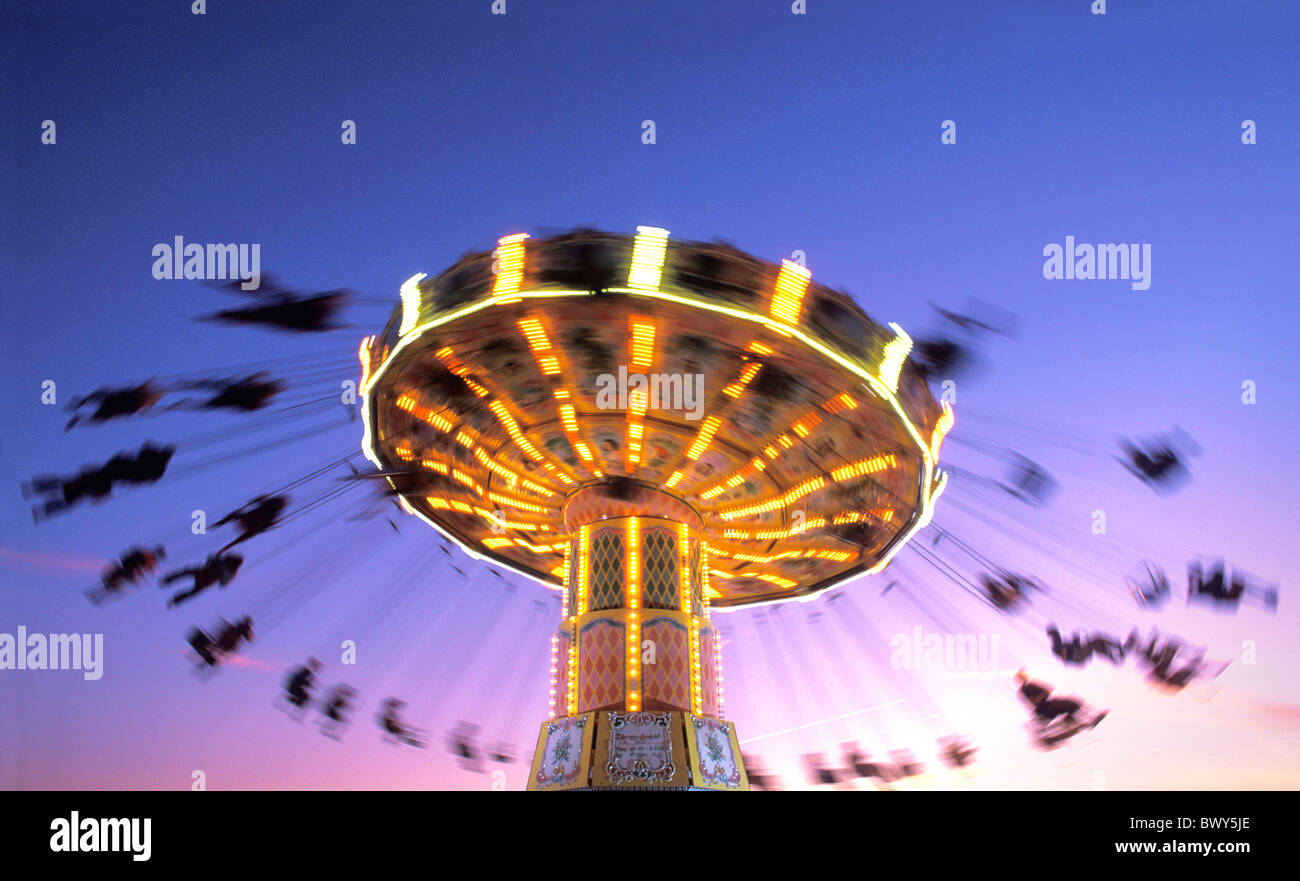 carousel chain carousel dusk fair illuminated mood rotary sky twilight ...