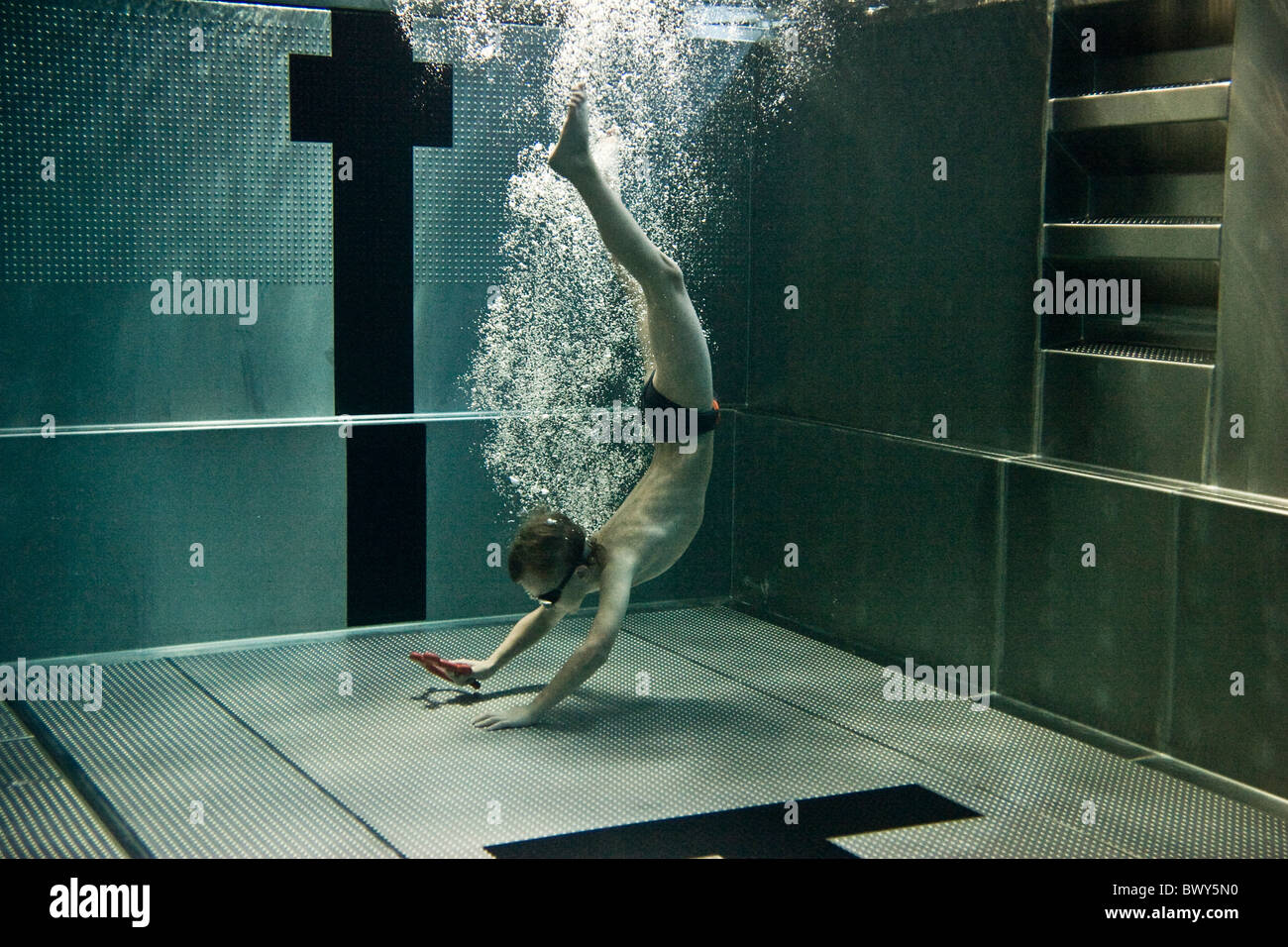 boy diving underwater on swimming pool Stock Photo - Alamy