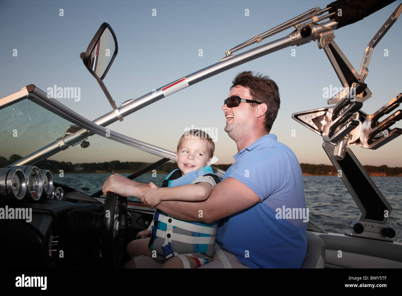 Father and Son in Speedboat Stock Photo - Alamy