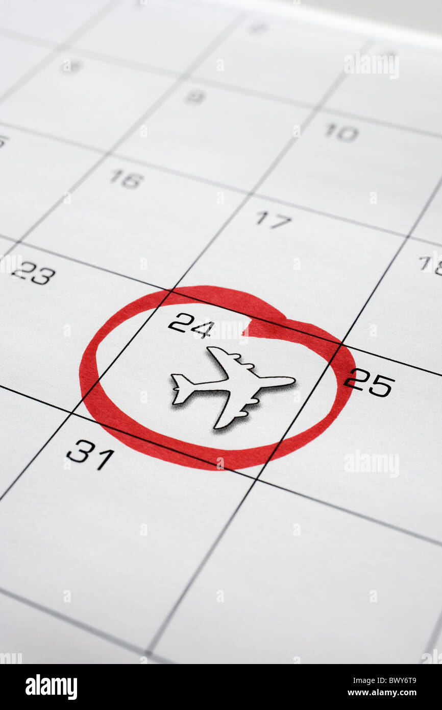Calendar with Airplane Circled Stock Photo - Alamy