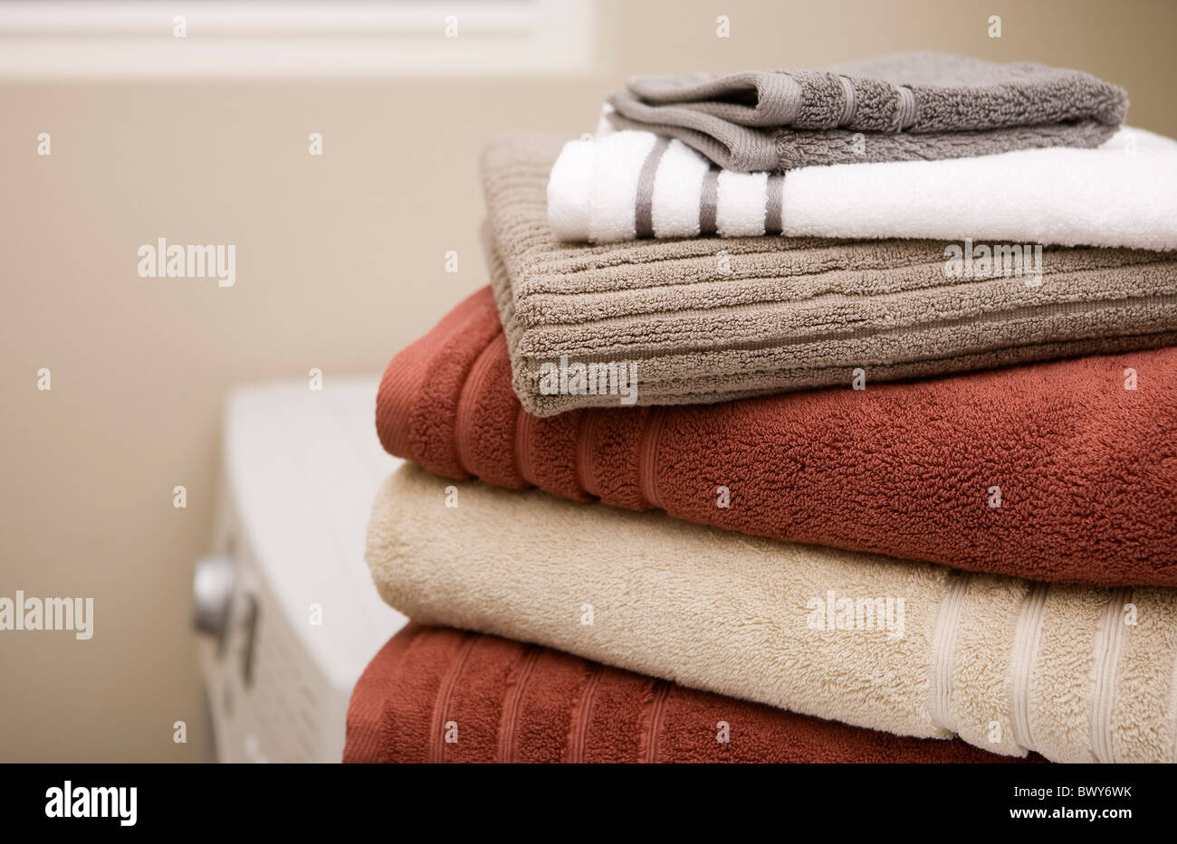 Stack of Clean Towels on Washer and Dryer Stock Photo - Alamy