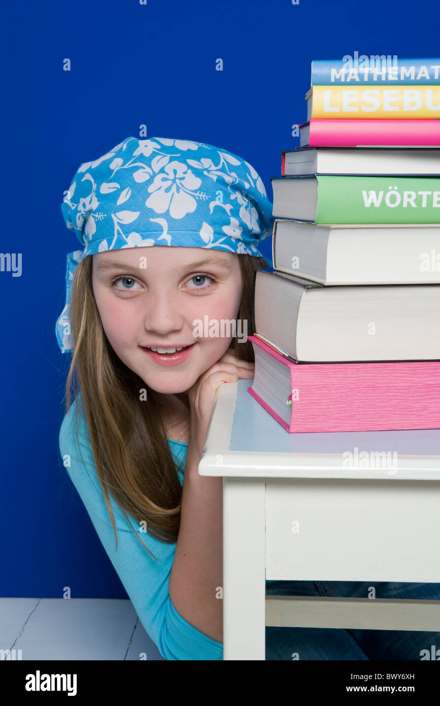 Young Girl With a Stack of Books Stock Photo - Alamy