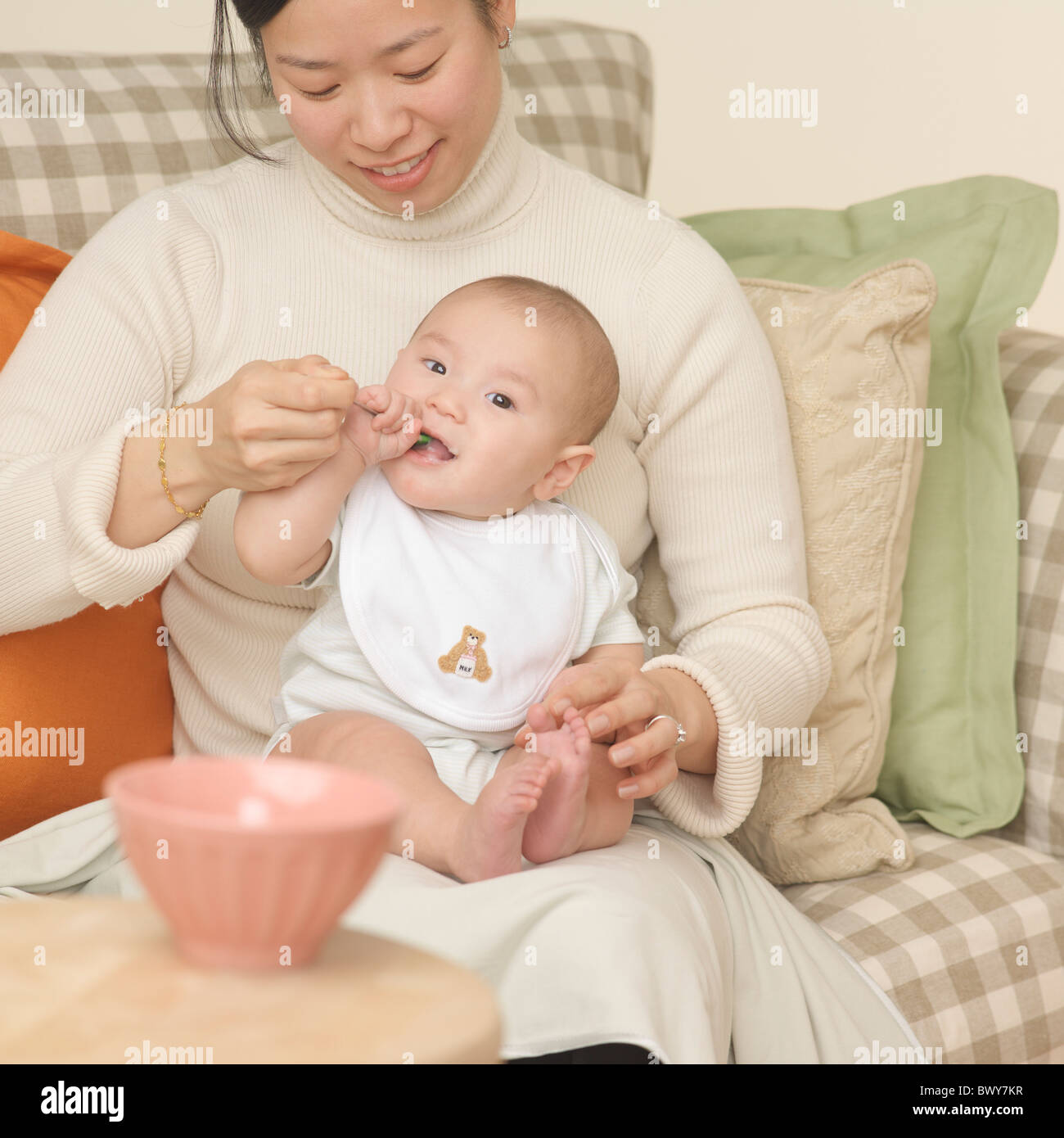 Mother Feeding Baby Stock Photo - Alamy