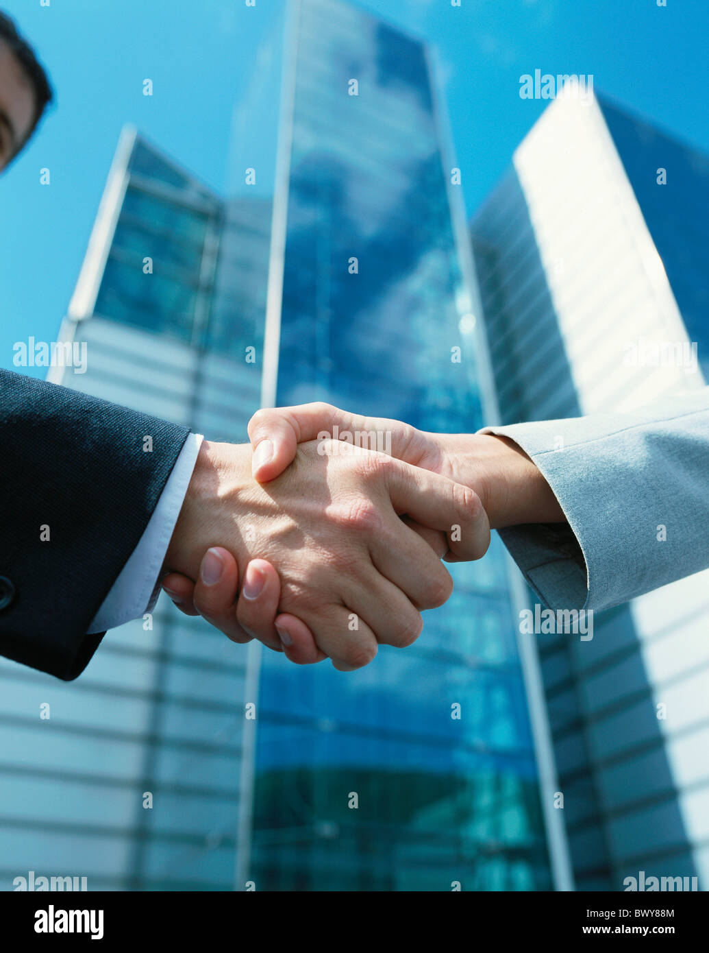 outside business close up handshake block of flats high-rise building ...