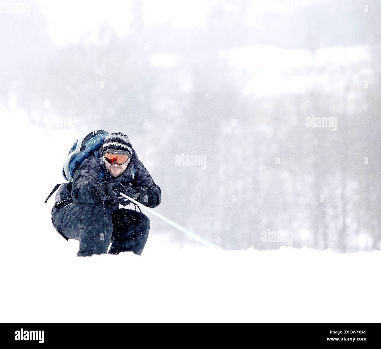 A young man snowboarding in the UK Stock Photo - Alamy