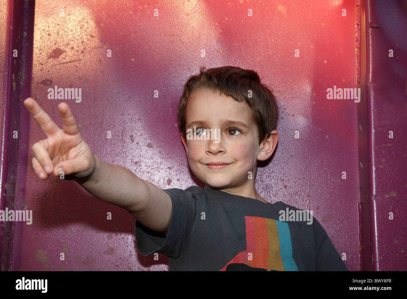Portrait of Boy making Hand Gesture Stock Photo - Alamy