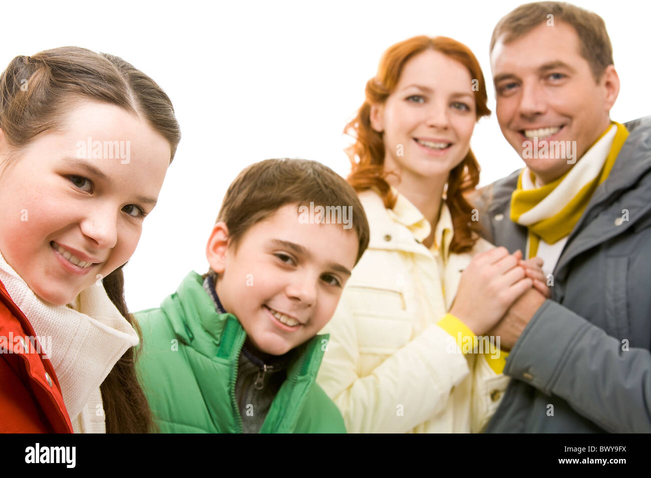 Portrait of happy girl with her brother and parents on background Stock ...