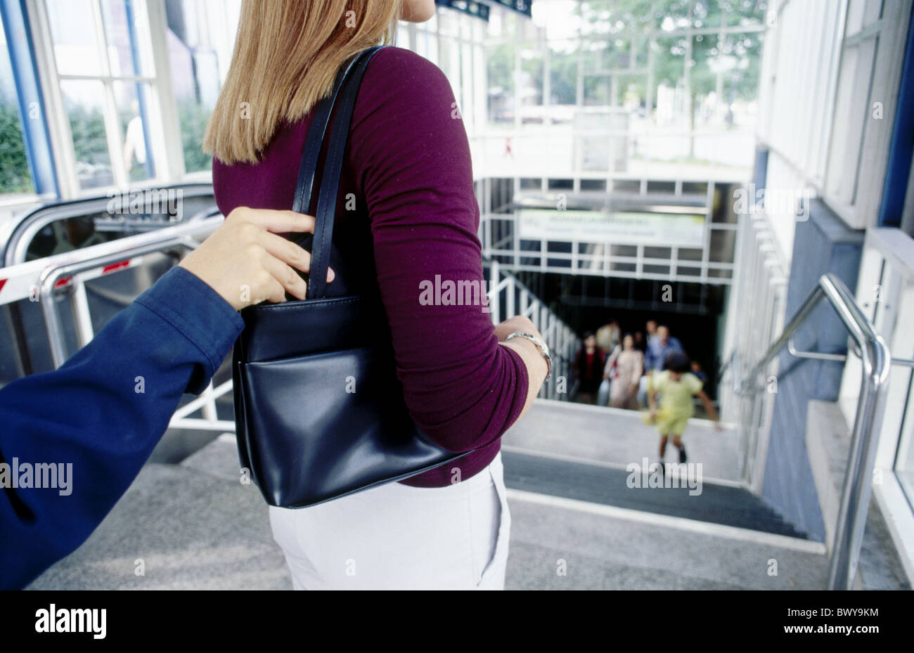 unsuspecting theft woman hand person steal pocket bag culprit underpass ...