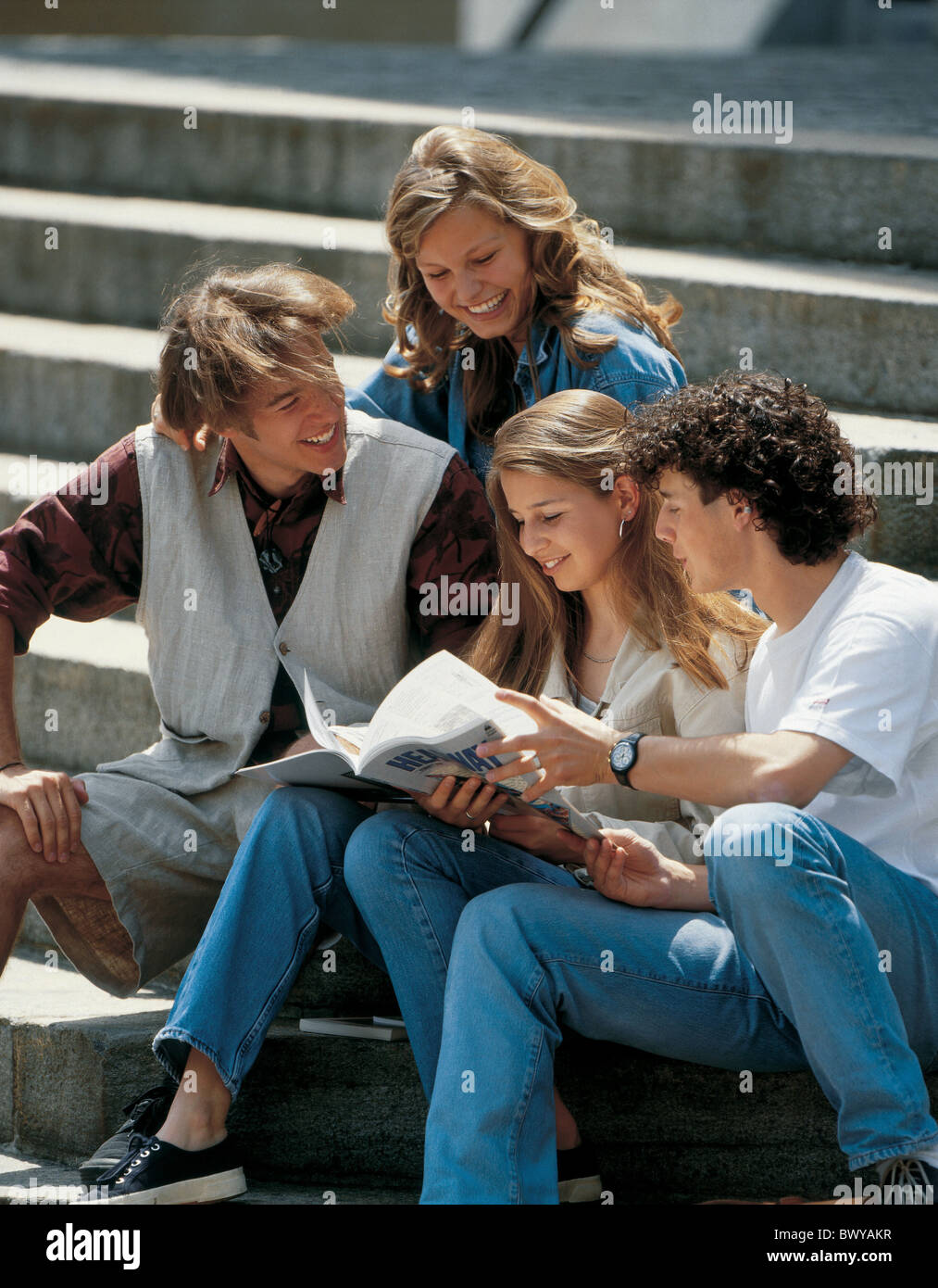 book Four group laughing learnings outside pupils read reading sitting ...
