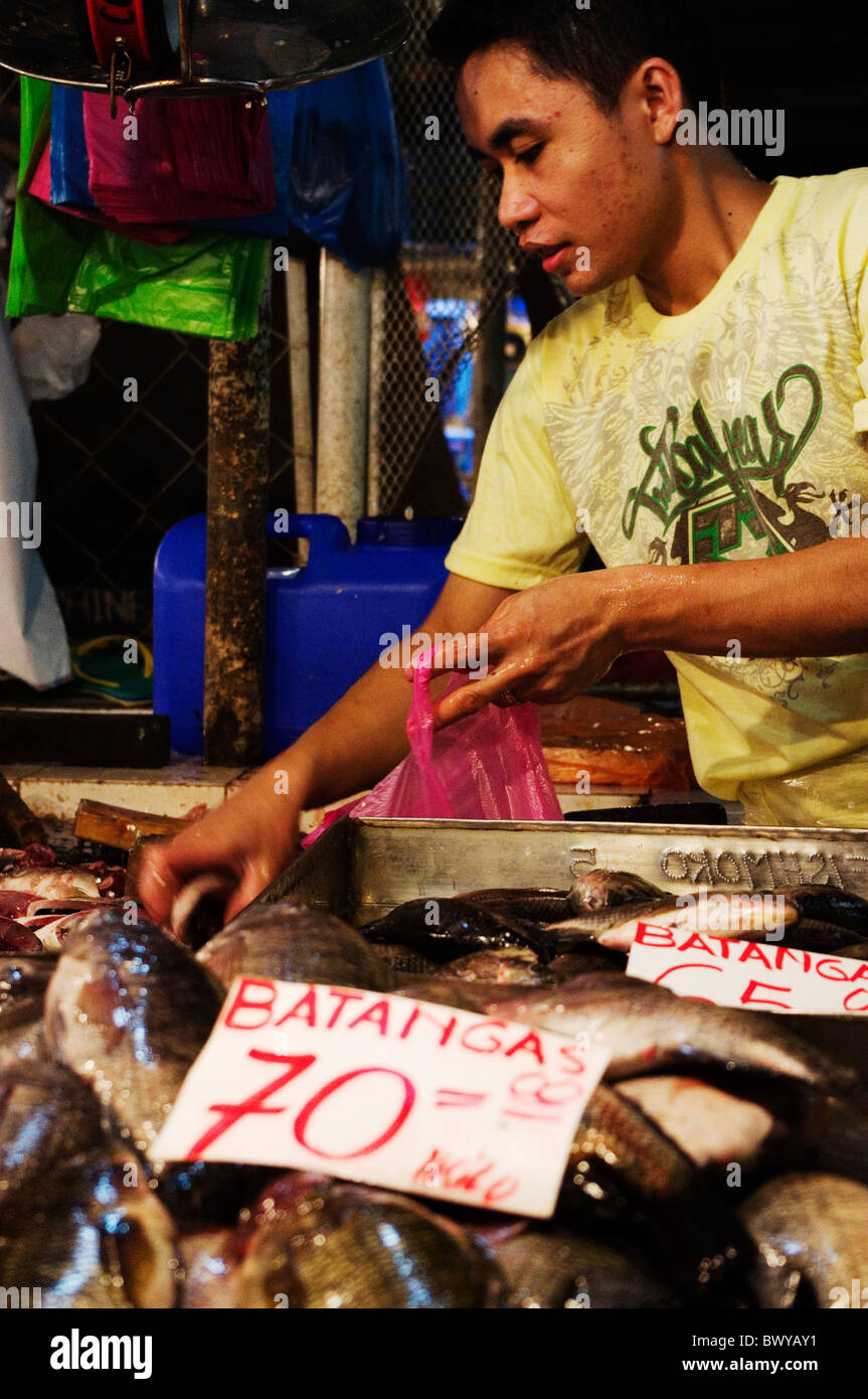 young man fish vendor, in Philippines Stock Photo - Alamy