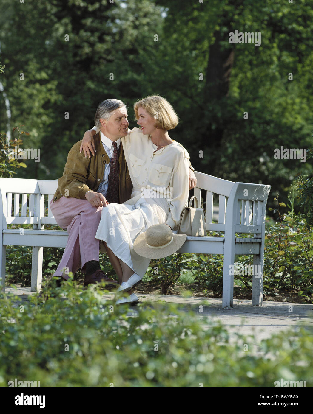 bank person middle age old person nature pair couple park embrace falls ...