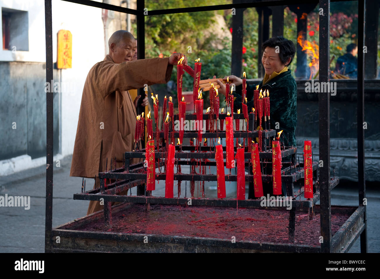 Monk lighting candles hi-res stock photography and images - Alamy