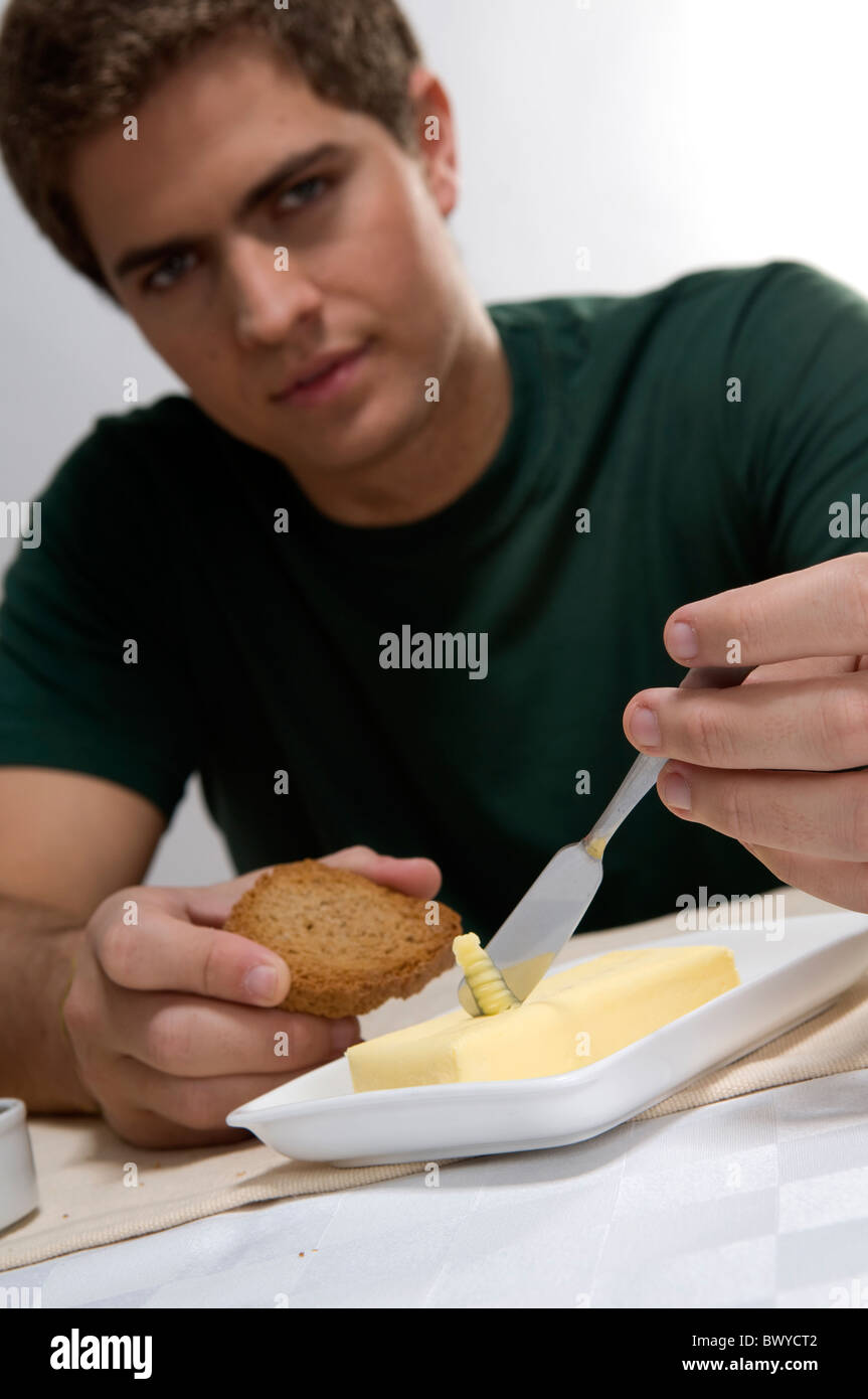Man with a toast and butter Stock Photo - Alamy