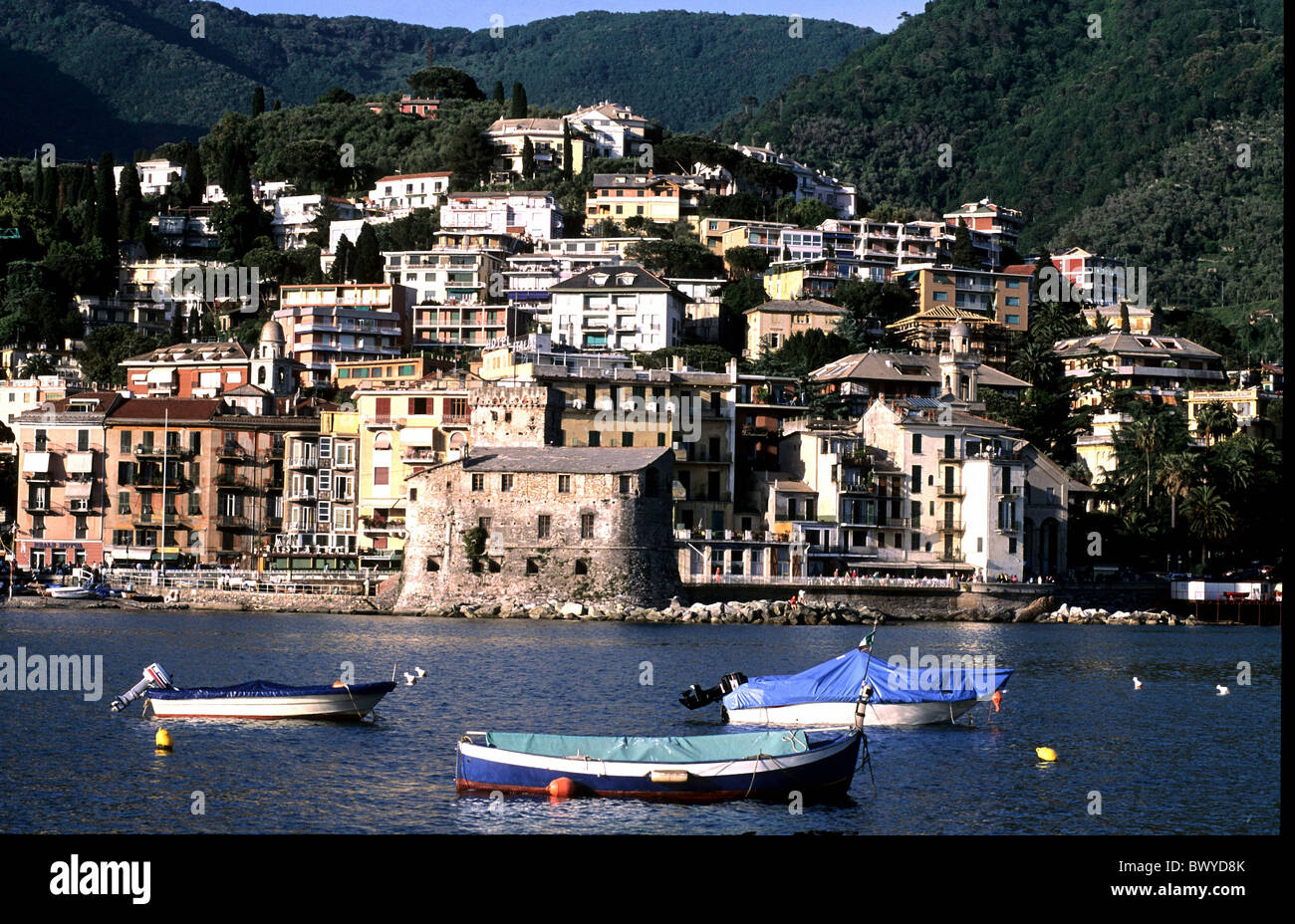 view facades fishing boats harbour port Italy Europe Liguria coast ...