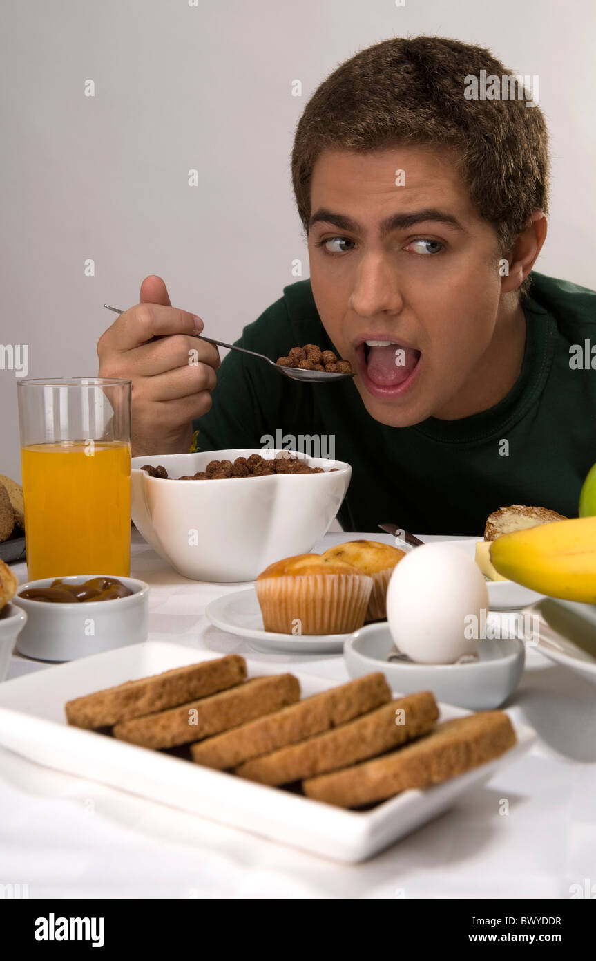 Man having breakfast, eating cereal Stock Photo - Alamy