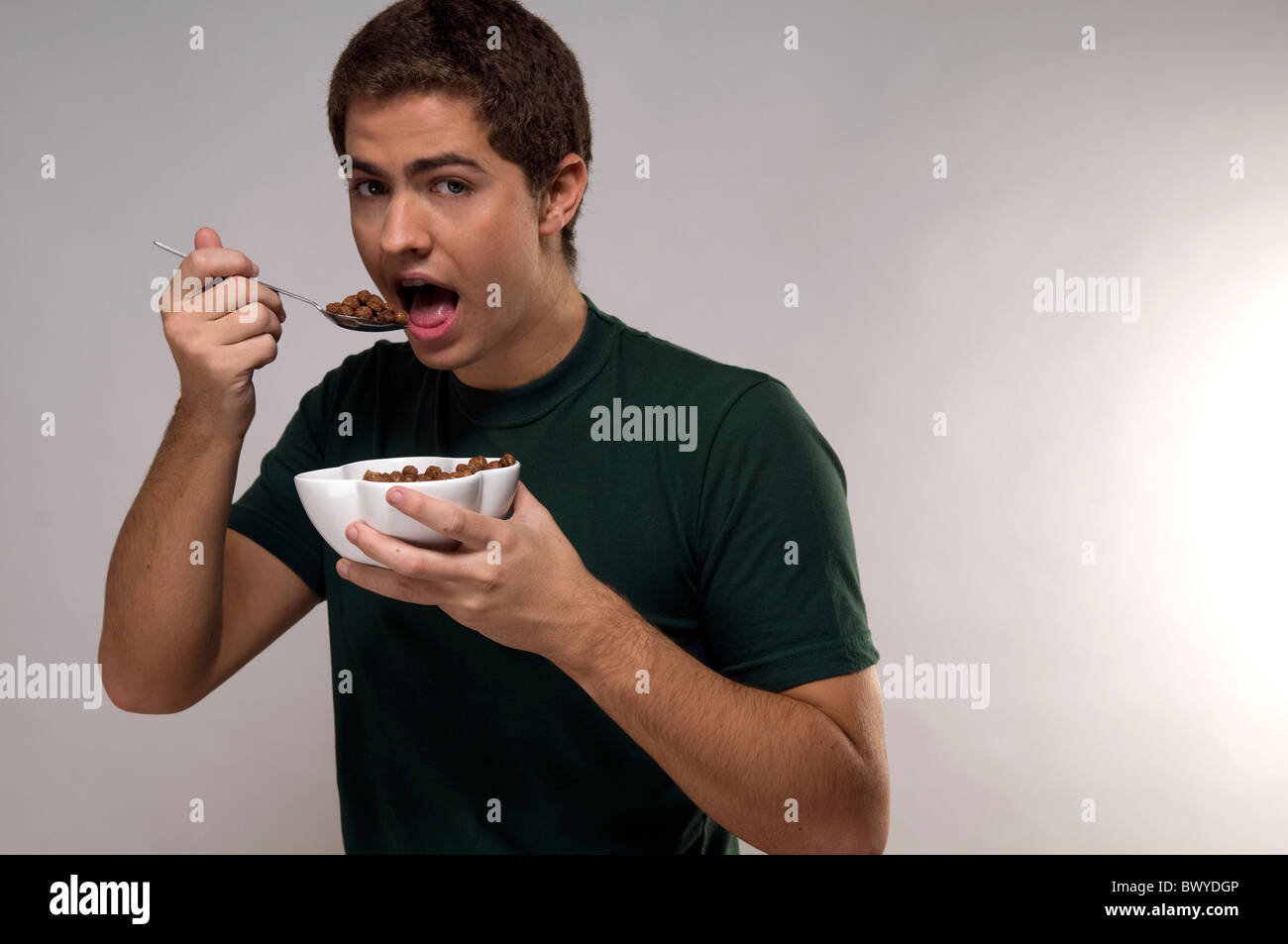 Happy fat man eating chocolate hi-res stock photography and images - Alamy