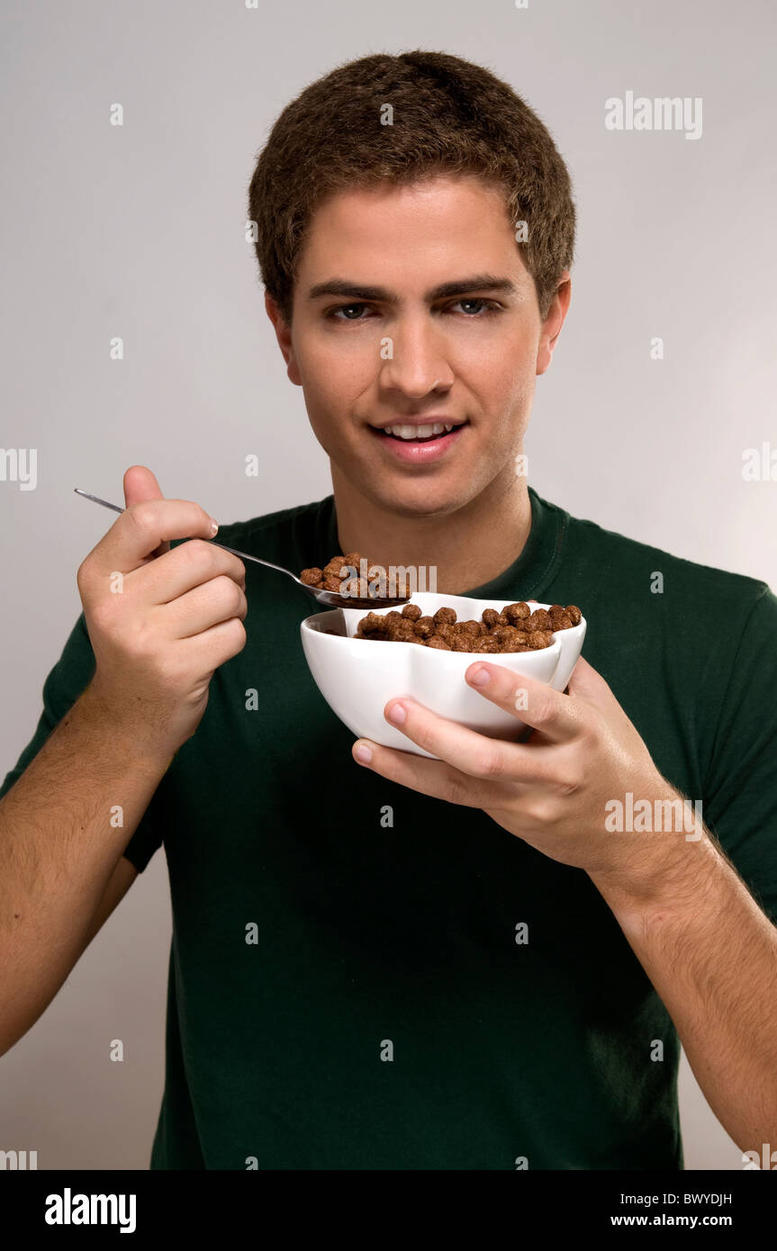 Happy fat man eating chocolate hi-res stock photography and images - Alamy