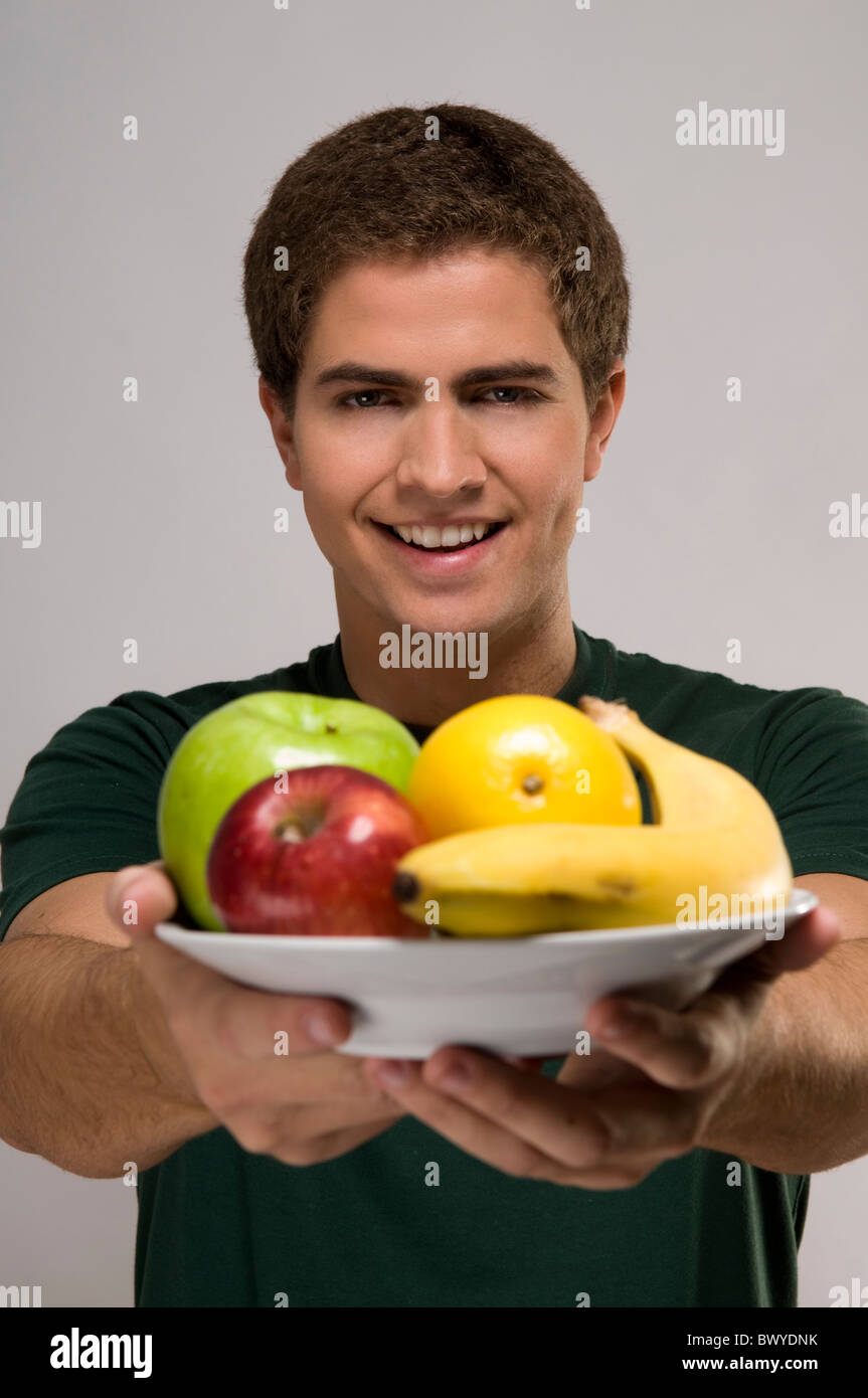 Fat man holding apple fruit hi-res stock photography and images - Alamy