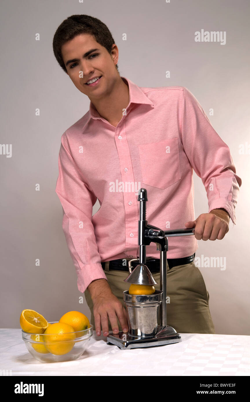 Man making orange juice Stock Photo - Alamy