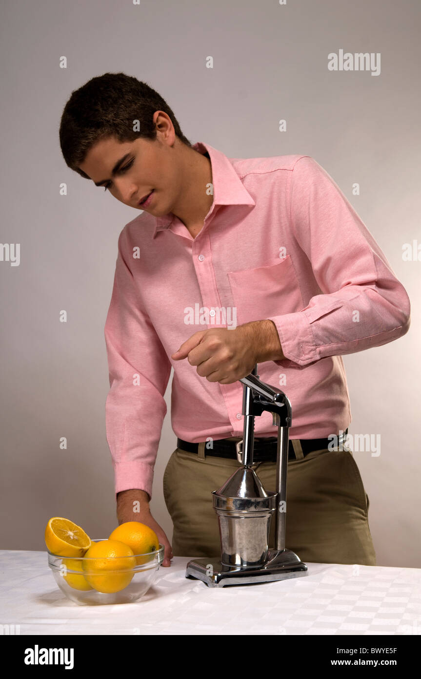 Man making orange juice Stock Photo - Alamy