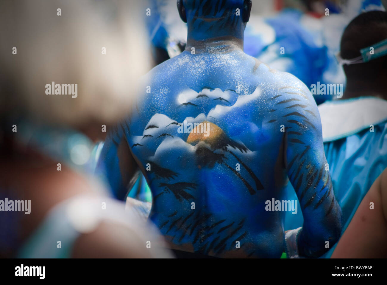 Trinidad Carnival man with body paint on his back from the band Trini ...