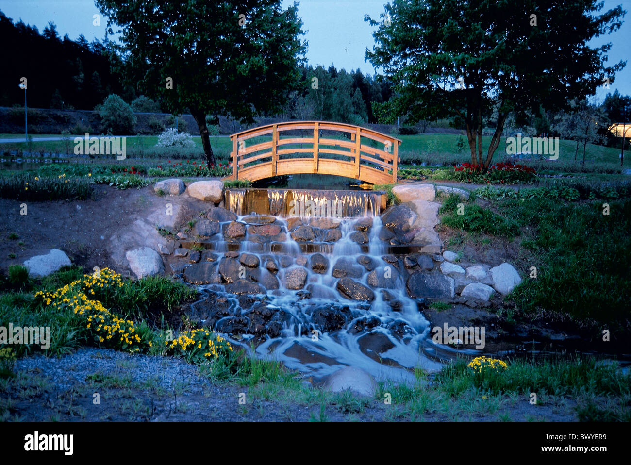 Creek brook flowers bridge dusk twilight garden Marsta park park Sweden ...