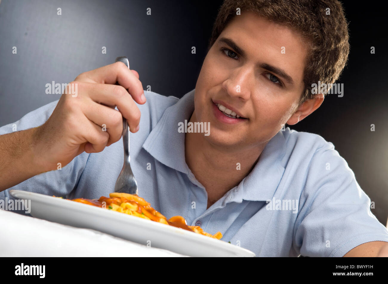 Man eating pasta Stock Photo - Alamy