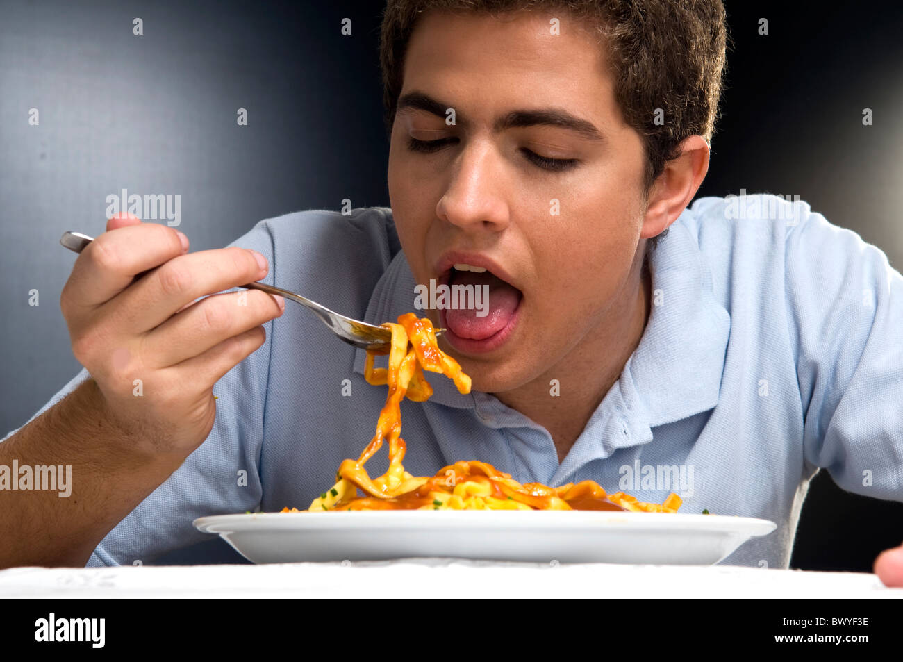 Man eating pasta Stock Photo - Alamy