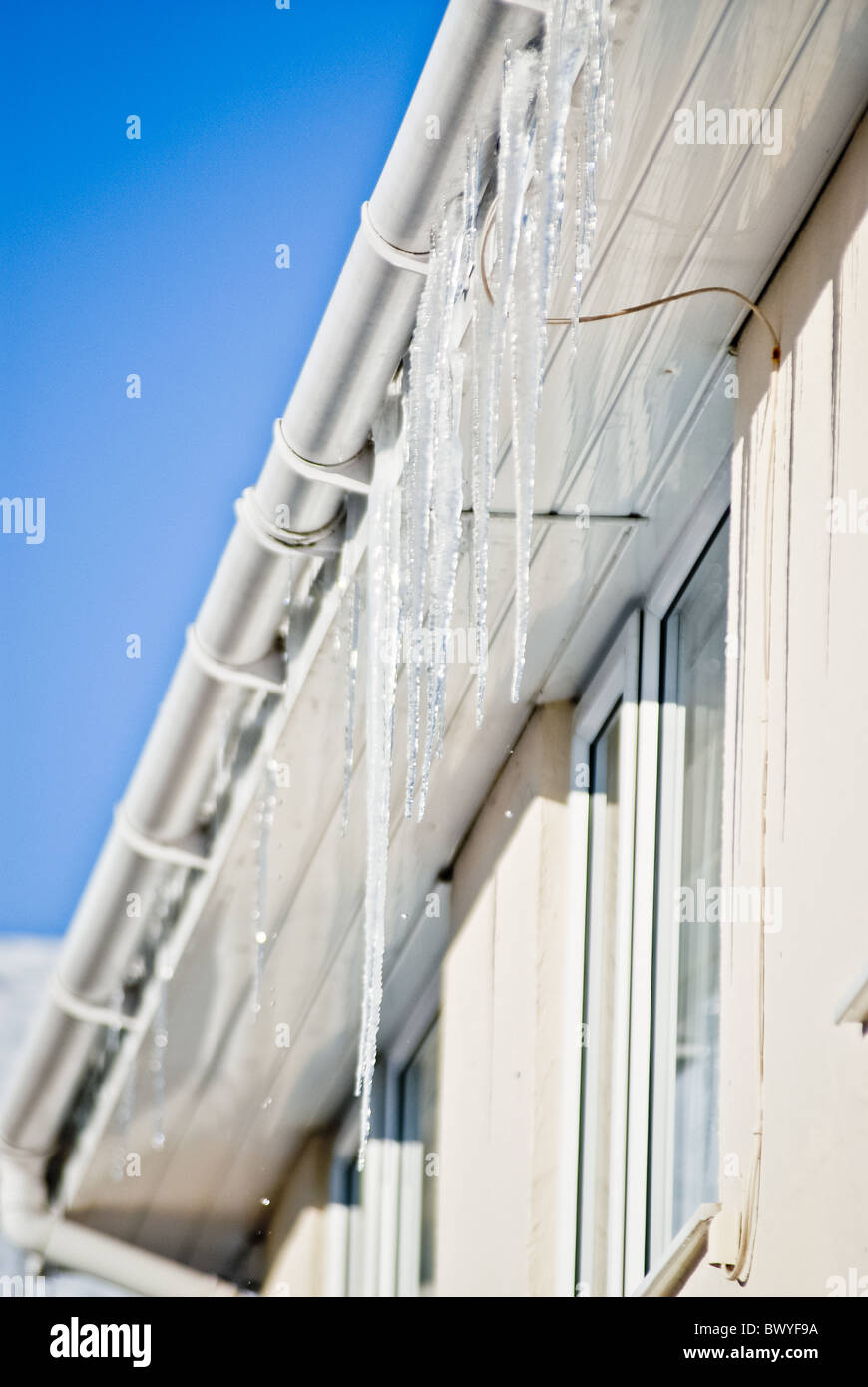 Ice on gutter Stock Photo - Alamy
