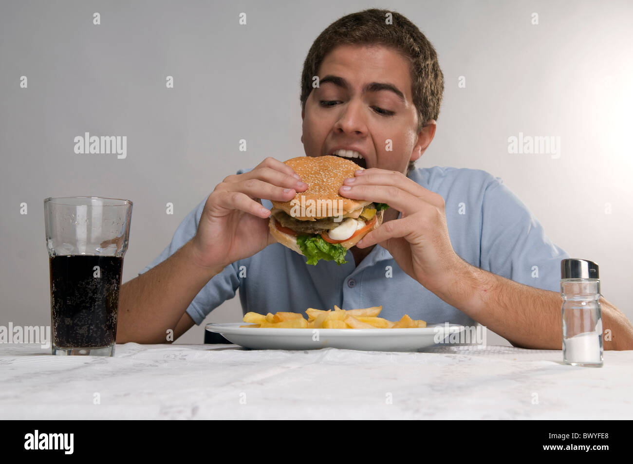 Man eating, mouth opened hi-res stock photography and images - Alamy