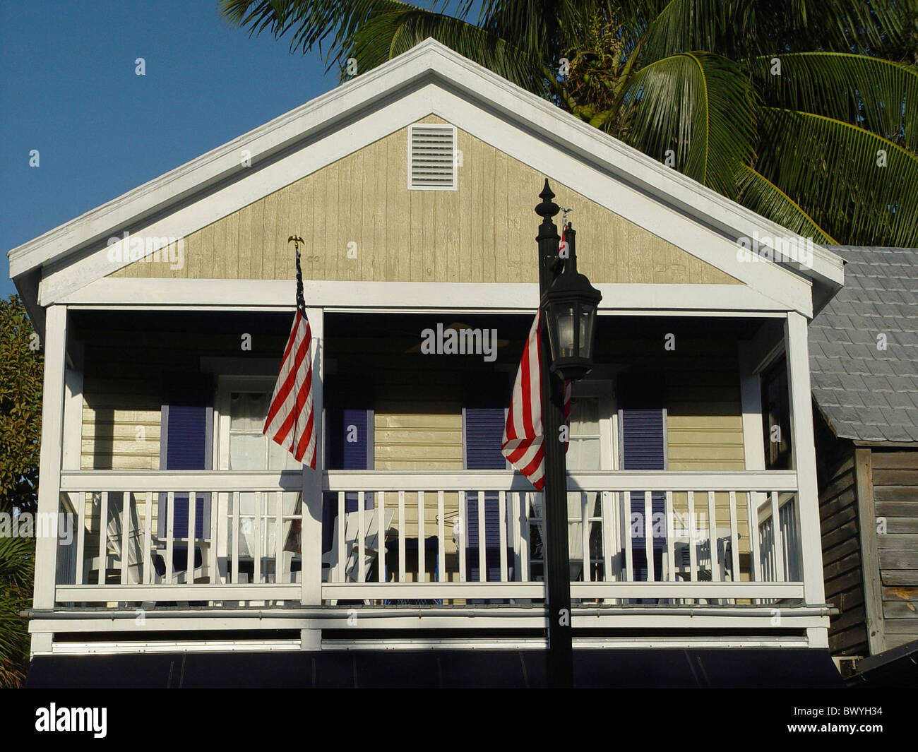 balcony facade flags Florida Keys gable home house Key West lantern ...