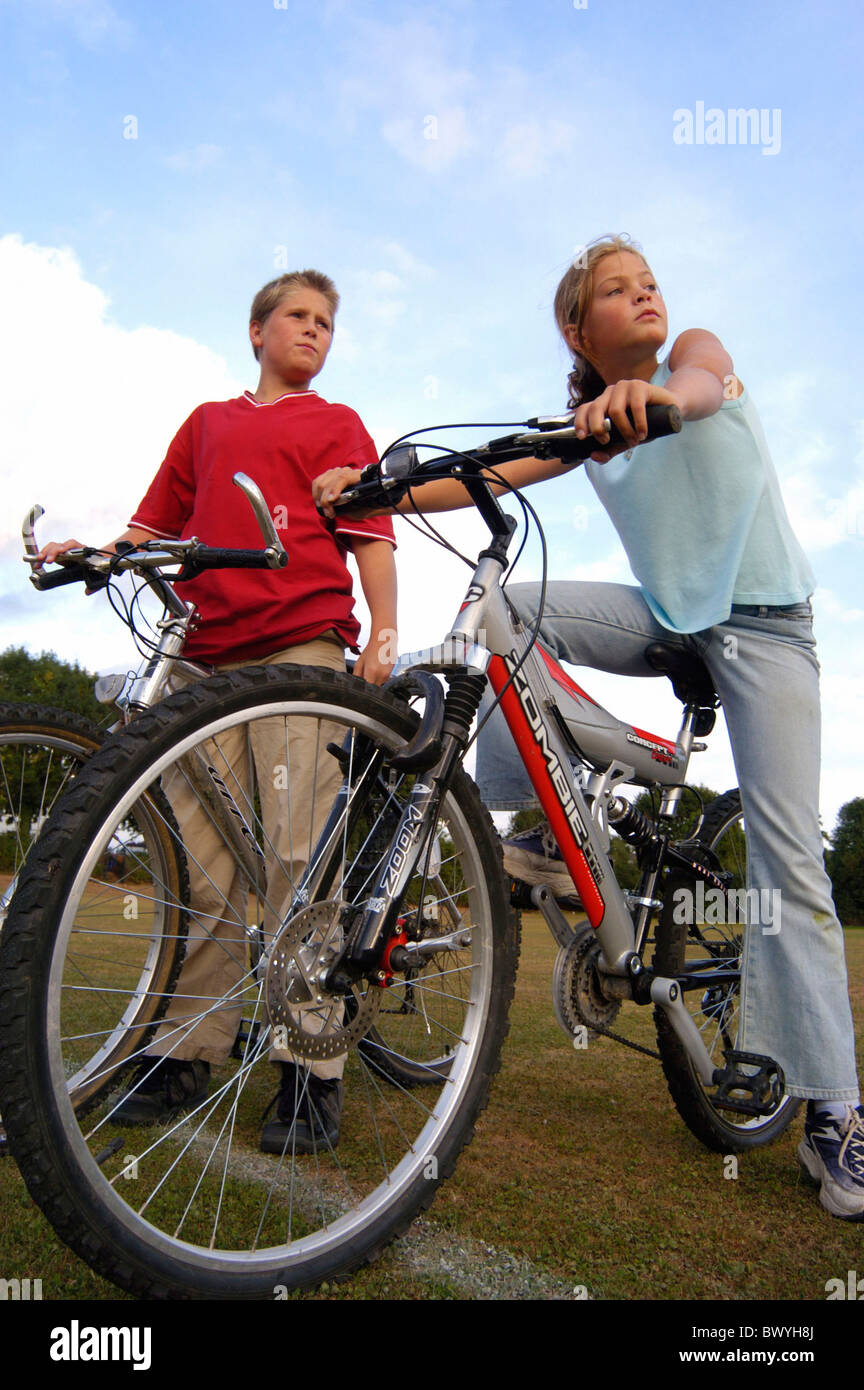 bicycle bike biking boy girl mountain bike two children Stock Photo - Alamy