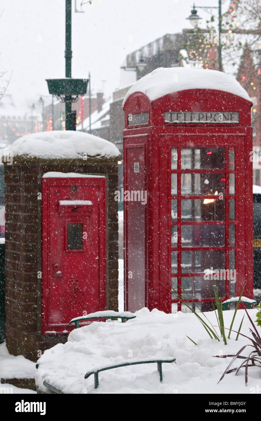 Red telephone box and letter box during snow Stock Photo - Alamy
