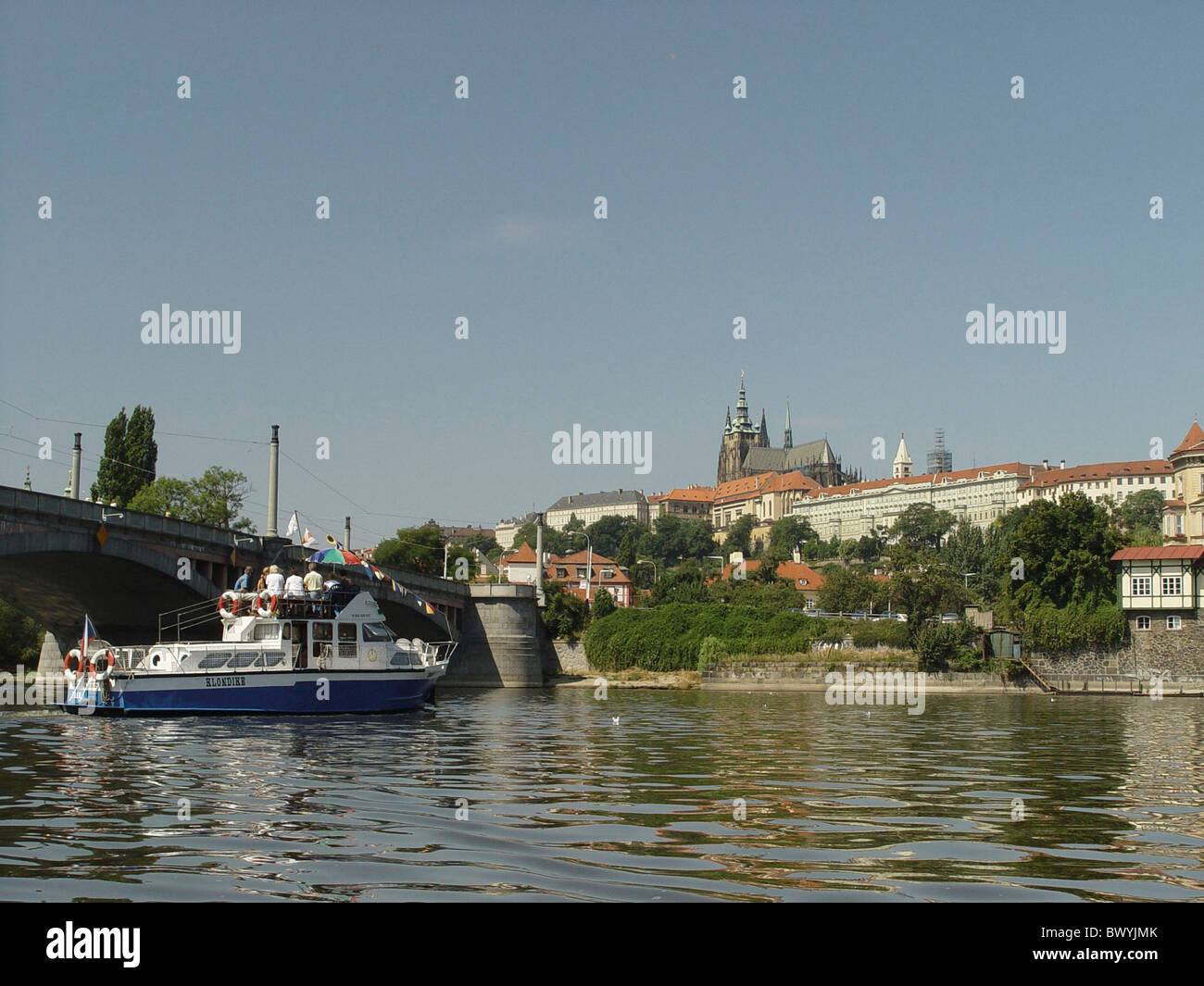 boat bridge river flow Hradcany Moldavia Prague Prague castle Czechia ...
