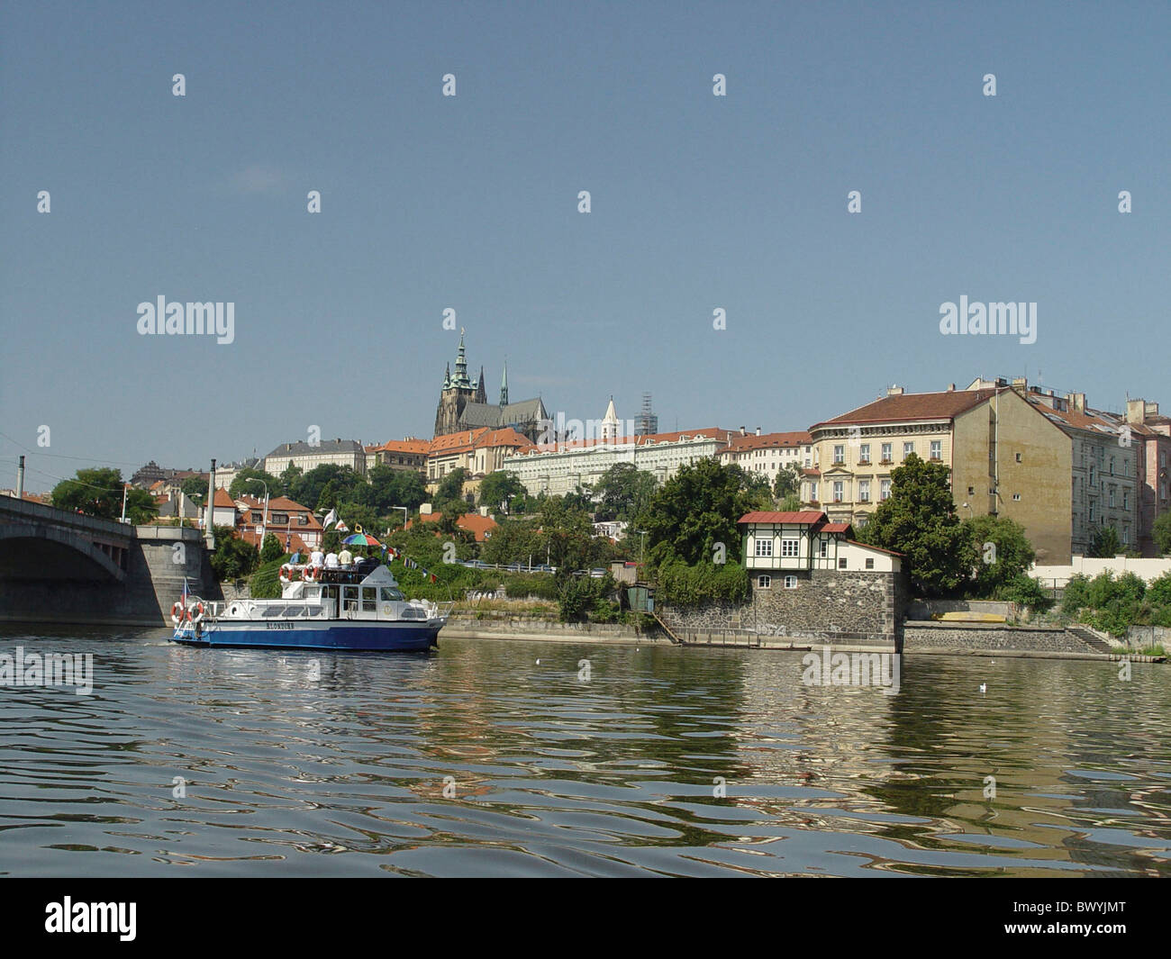 boat bridge river flow Hradcany Moldavia Prague Prague castle Czechia ...