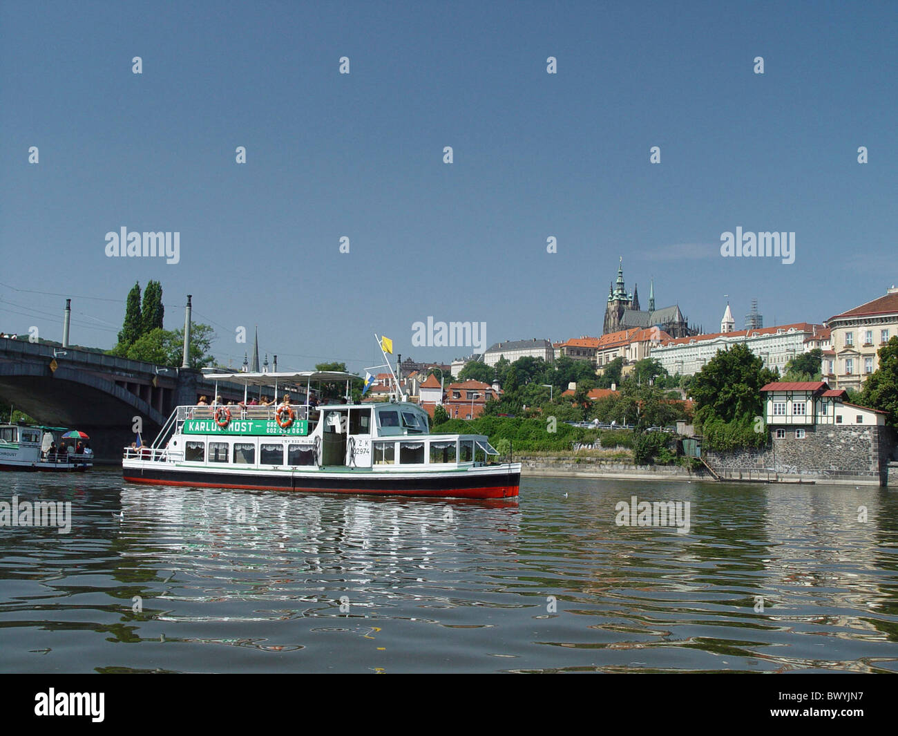 boat bridge river flow Hradcany Moldavia Prague Prague castle ship ...