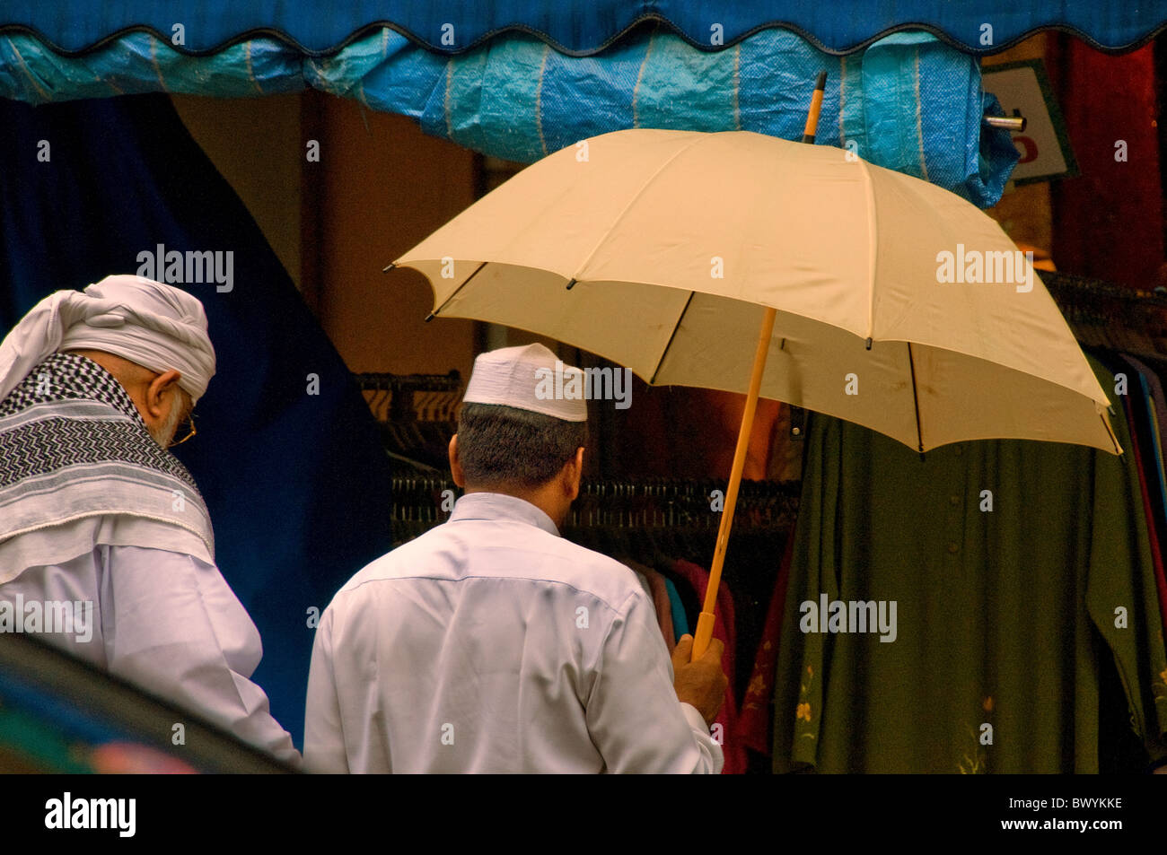 Two Arab men walking Stock Photo - Alamy