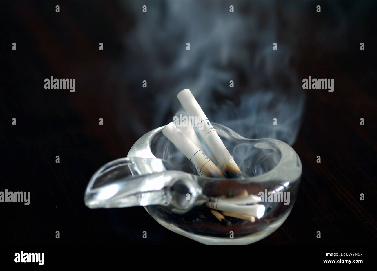 Ashtray burning cigarettes health injurious problematical smoke smoking ...