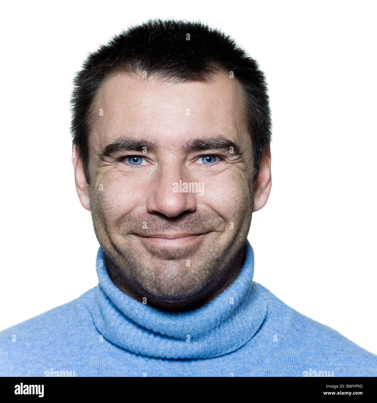 studio portrait on isolated background of a stubble man smiling Stock ...