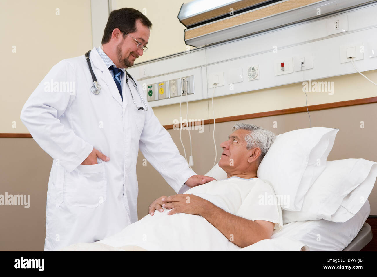 Doctor talking with patient in hospital Stock Photo - Alamy