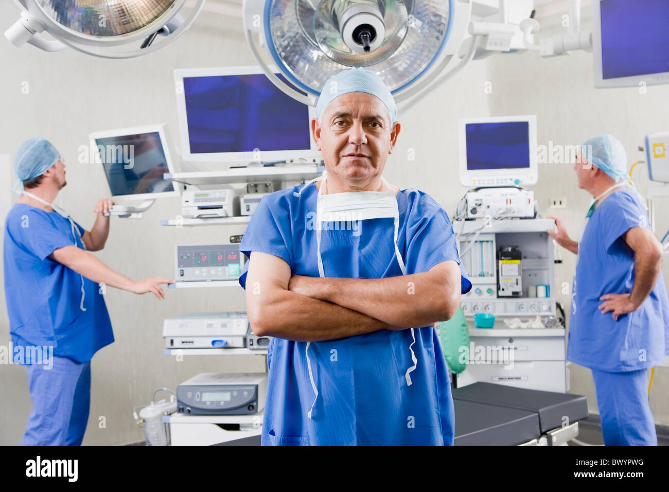 Surgeons in hospital operating room Stock Photo - Alamy