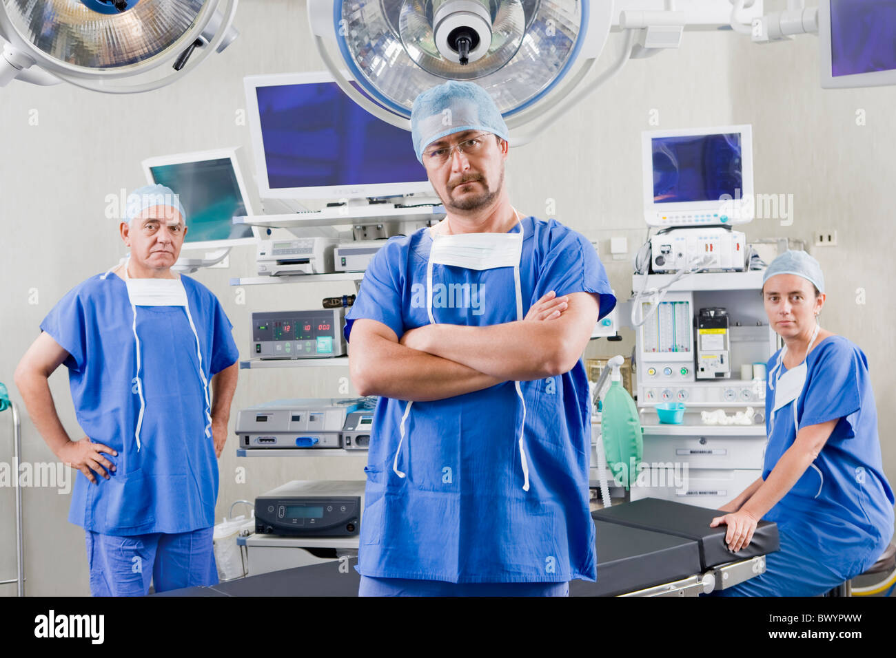 Surgeons in hospital operating room Stock Photo - Alamy